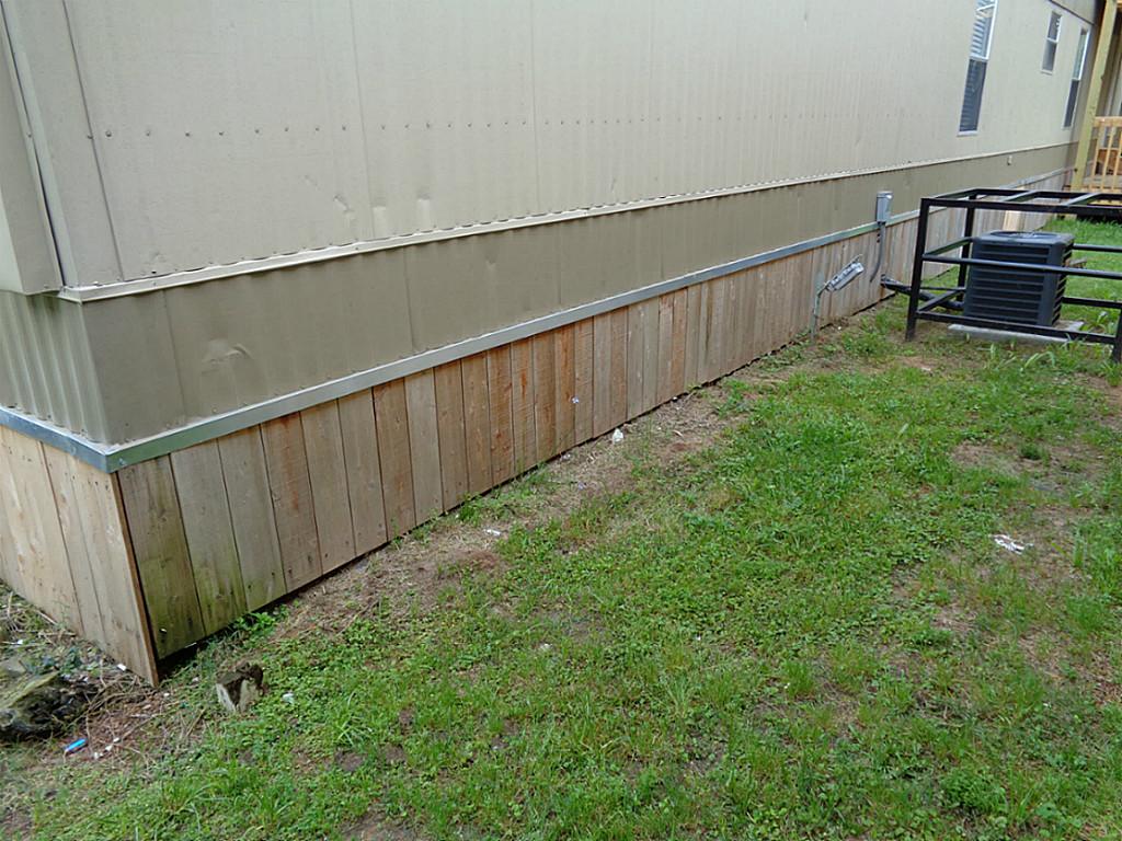 Mobile Home Underpinning: Calculating the Cost + DIY Guide